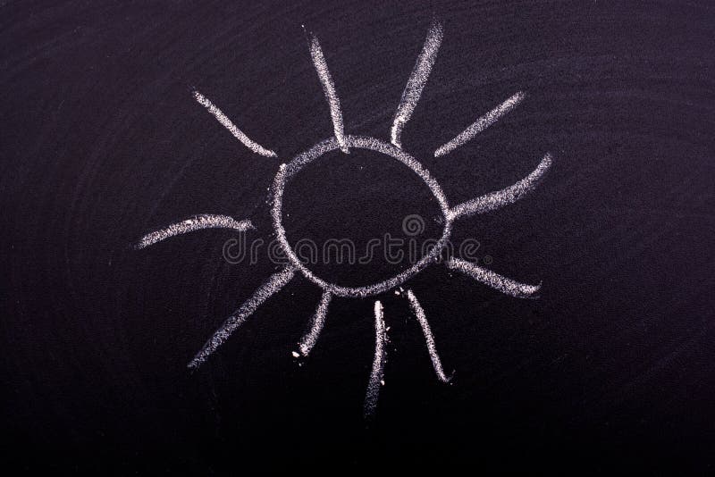 Closeup Shot of a Sun Drawn on a Blackboard with Chalk Stock Photo ...