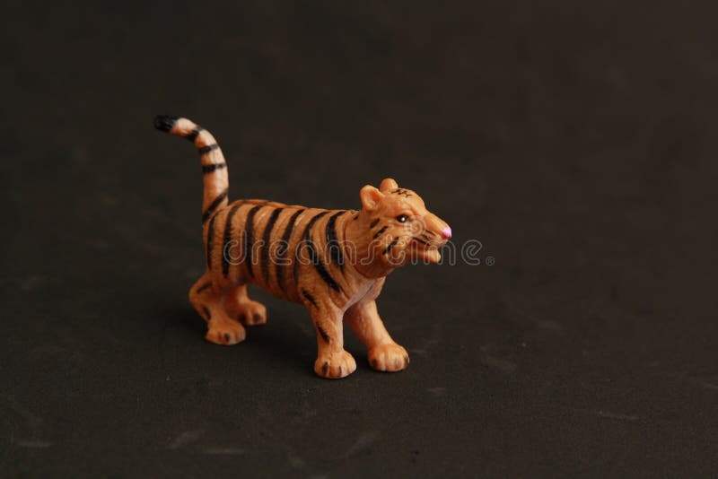 Closeup Shot of a Tiger Rubber Toy Isolated on a Black Background Stock ...