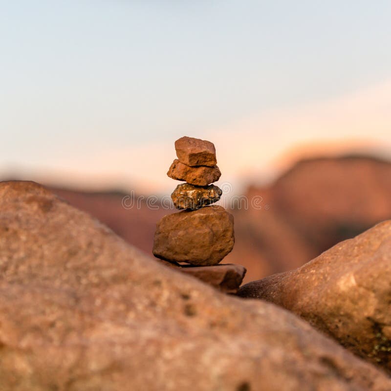 Closeup Shot of Tiny Stones in a Small Cairn Surrounded by Rocks - the ...