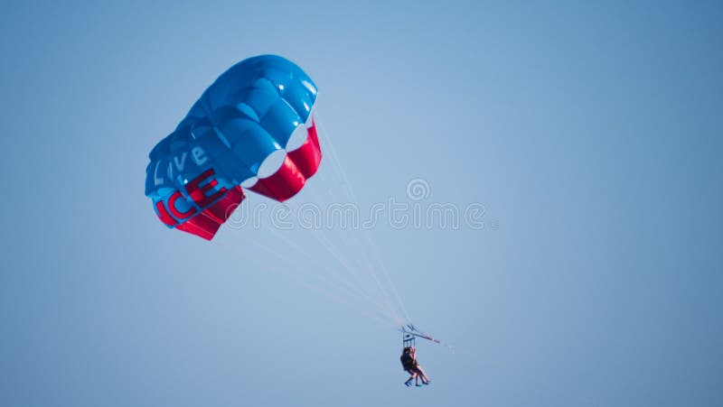 Closeup Shot of Tourists Having Fun by Flying Parachute Parasailing in ...
