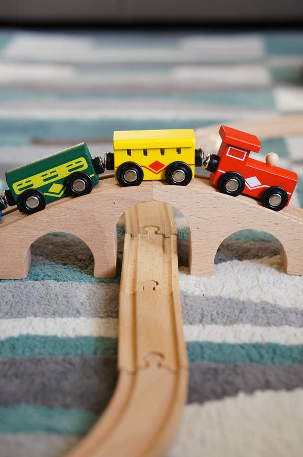 Closeup Shot of a Toy Train on a Wooden Bridge Stock Image - Image of ...