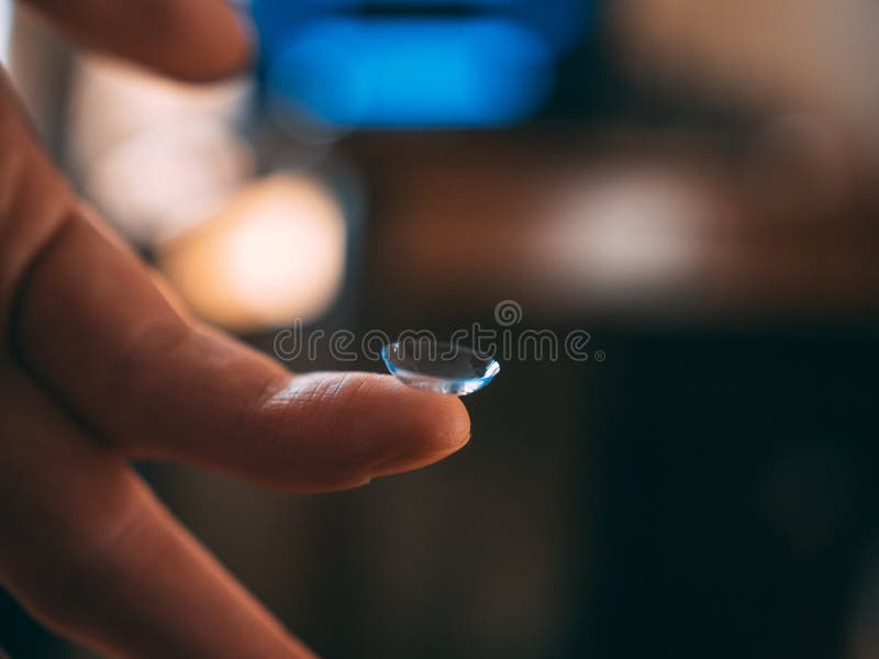 Closeup Shot of a Transparent Eye Lens on a Finger Stock Image - Image ...