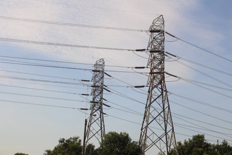 Closeup Shot of Two Electrical Towers Connected with Cords Stock Photo ...