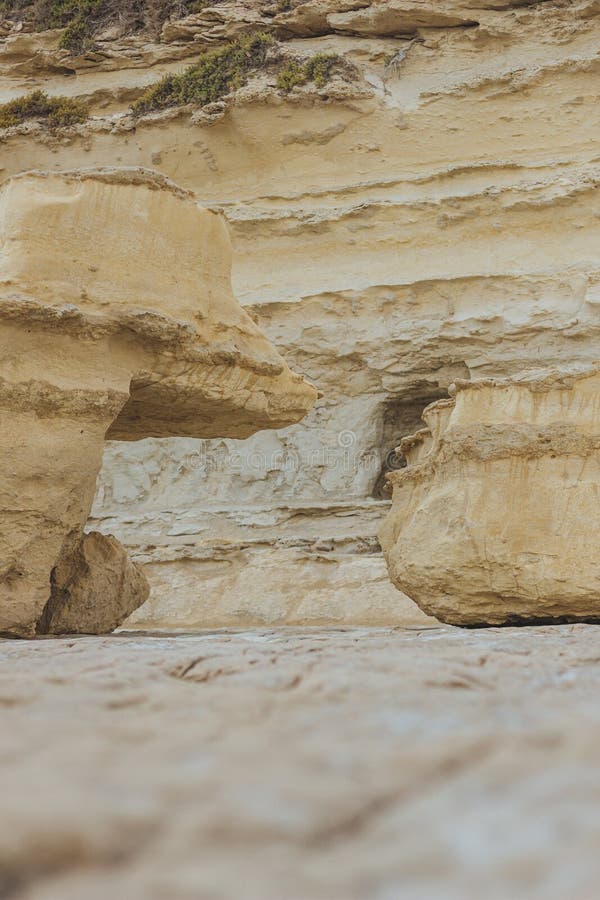 Closeup Shot of Two Yellow Rock Pieces on the Shore Stock Photo - Image ...