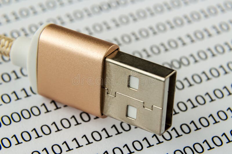 Closeup Shot of a USB Cable on a Piece of Paper with Numbers and Codes ...