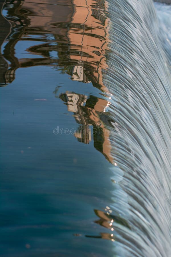 Closeup Shot of Water Flow with the Reflection of a Building Stock ...