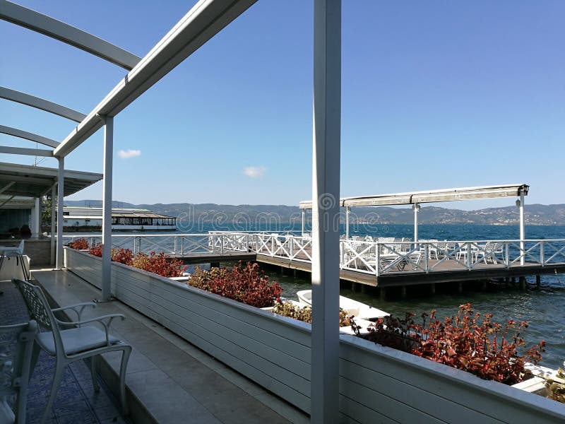 Waterfront deck patio stock image. Image of bright, outdoor - 4072765