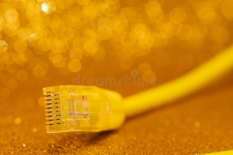 A Closeup Shot of a Yellow Lan Cable on a Yellow Surface Stock Photo ...
