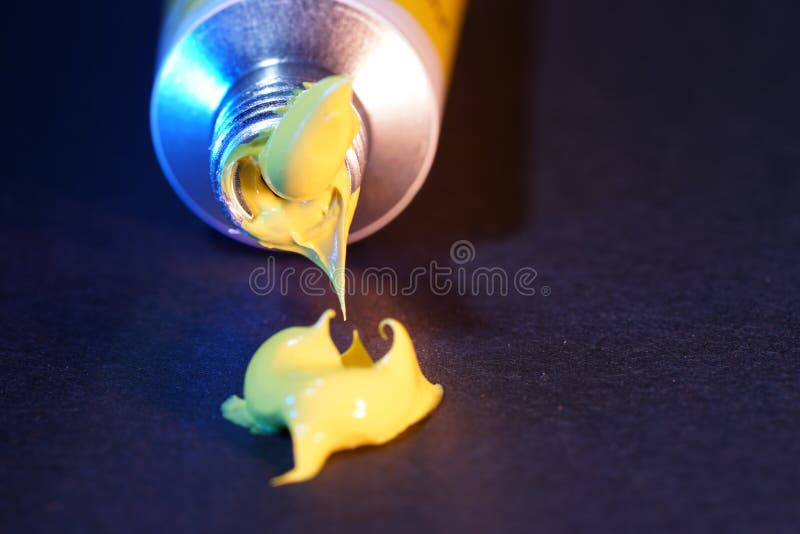 Closeup Shot of a Yellow Paint Tube Stock Photo - Image of background ...