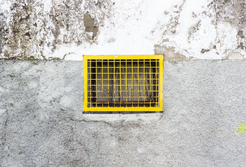 Closeup Shot of a Yellow Rusty Metal Window Grill on an Old Wall with ...