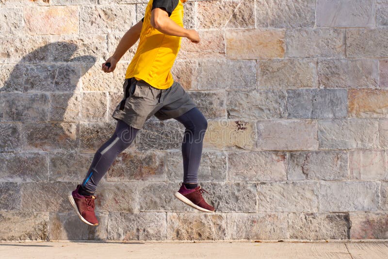 Closeup Shot of a Young Athletic Man Running on the Street Stock Photo ...