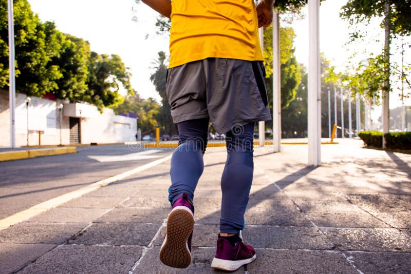 Closeup Shot of a Young Athletic Man Running on the Street Stock Photo ...