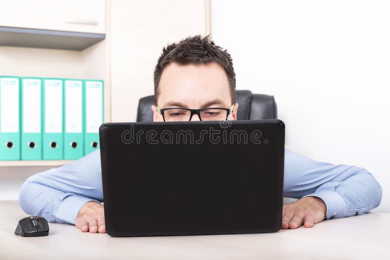 Closeup Shot of a Young Businessman with Glasses Working on a Computer ...