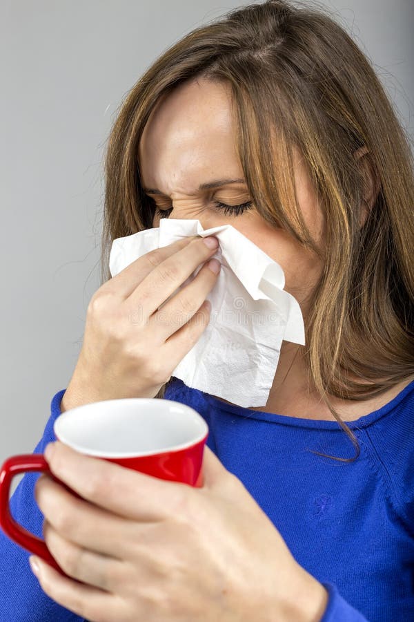 Closeup Of Sick Young Woman Blowing Her Nose Stock Image Image Of