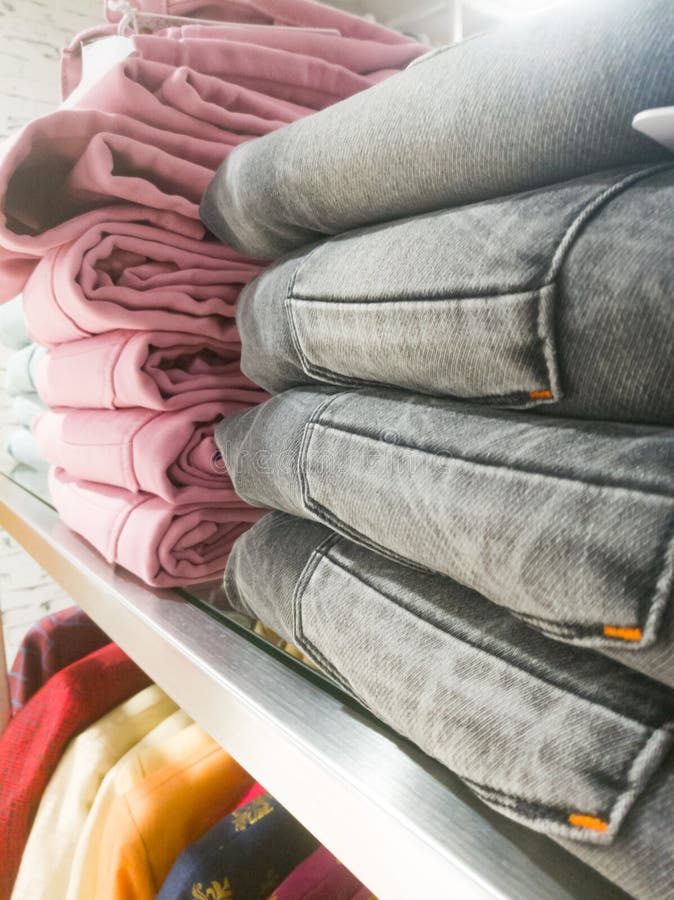 A Closeup Side Angle View of a Stack of Pants Placed on the Shelf Stock ...