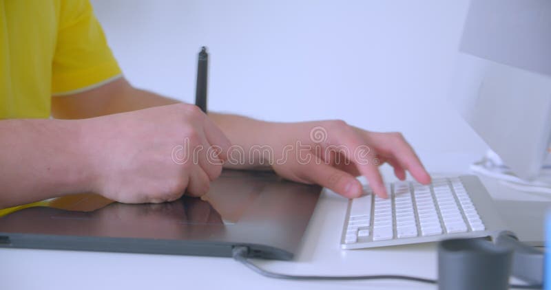 Closeup Side View Shoot of Designer Hands Typing on the Graphic ...