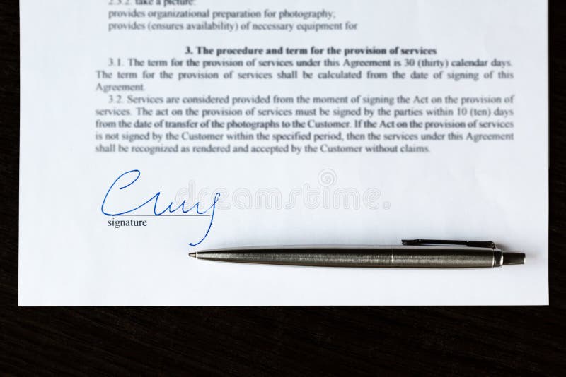 Closeup of Signature and Silver Ballpoint Pen with on Document Stock ...