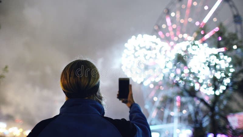 Closeup Silhouette of Man Watching and Photographing Fireworks Explode ...