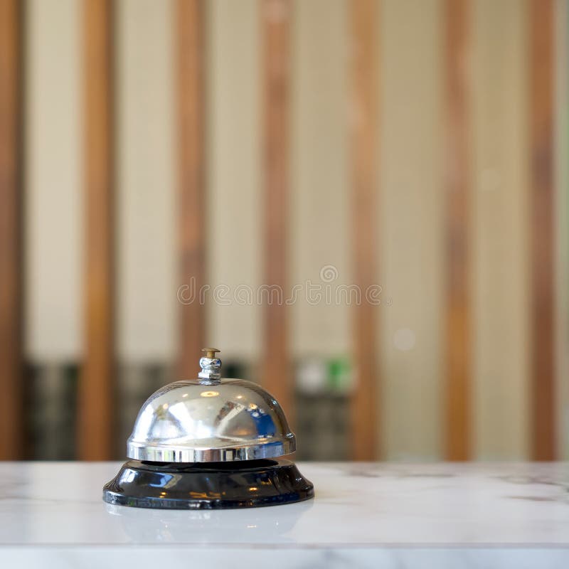 Closeup of a Silver Service Bell on Hotel Reception Desk Stock Photo ...