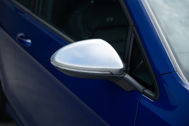 Closeup of a Silver Shiny Side-view Mirror of a Blue Under the Lights ...