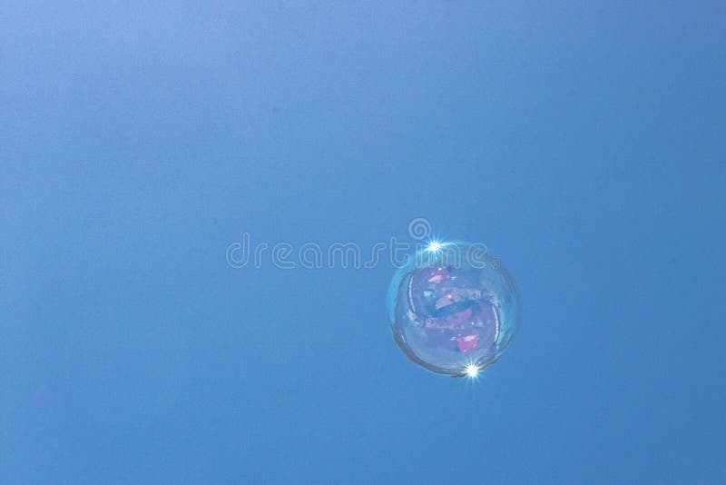 Closeup of Single Bubble Floating in Background of Blue Sky Stock Photo ...