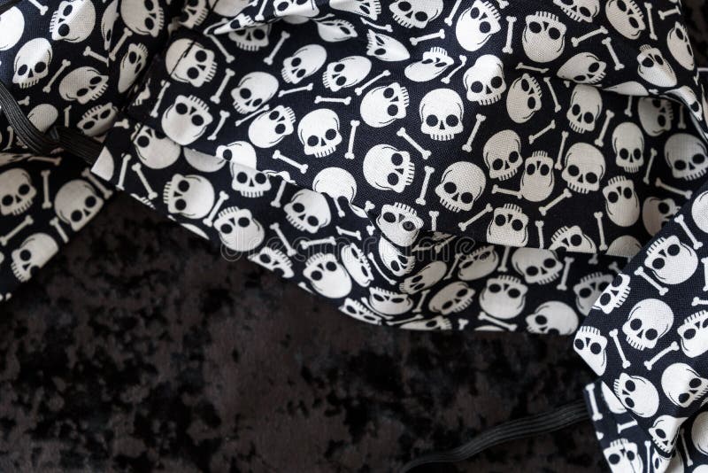 Closeup of a Skull and Bones, Black and White Fabric Face Mask, on a ...