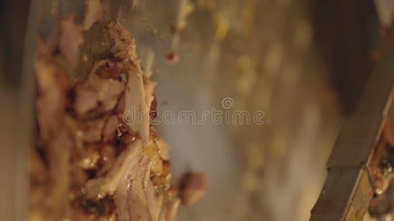 Closeup Slow-motion of Shawarma Meat Pieces Falling on the Grill ...
