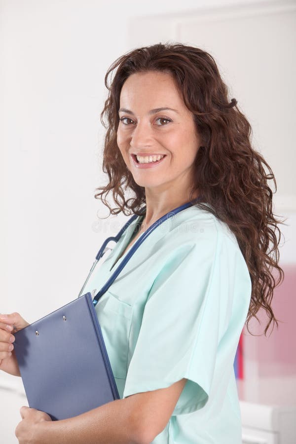 Closeup of smiling doctor stock photo. Image of examination - 16261568