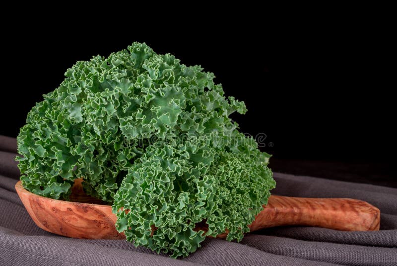 Closeup of Some Leaves of Kale Forming a Heart on a Dark Background ...