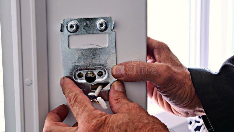 Installing a new door lock stock photo. Image of closeup - 348656496