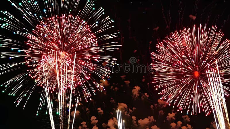 Dazzling Starburst Firework Explosion with Vibrant Red and Gold Sparks ...