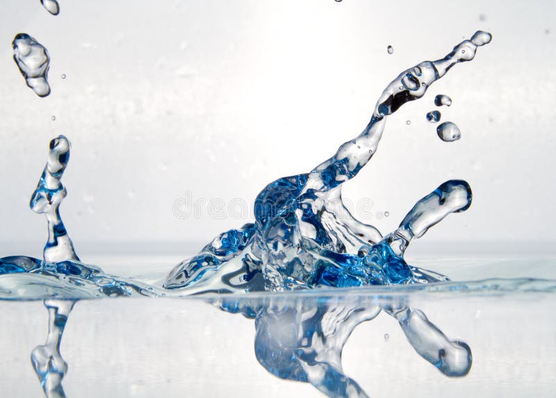 Closeup of Splashing Water Under the Lights on a White Background Stock ...