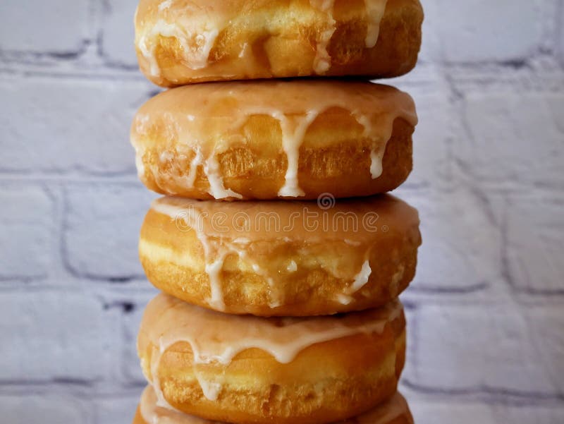 Closeup Stack of Delicious Glazed Donuts with White Brick Wall Stock ...