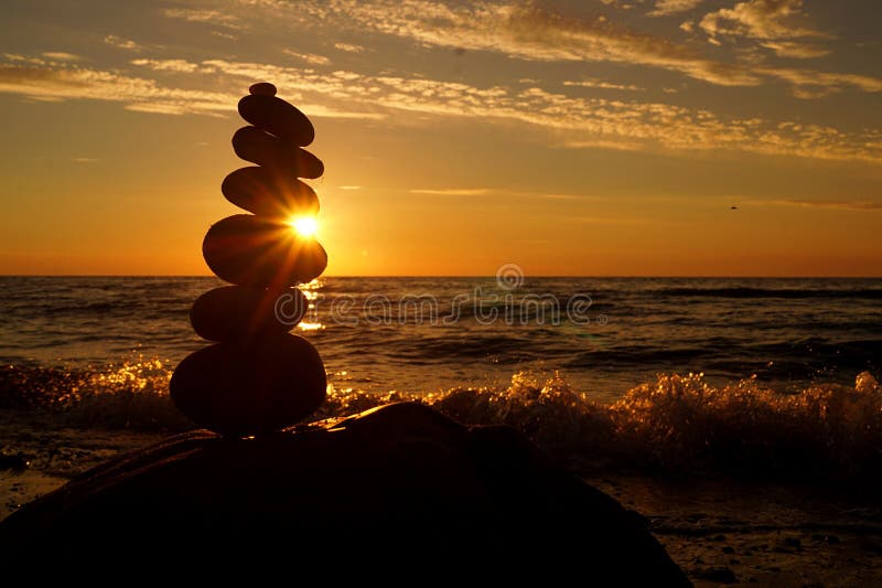 Stack of Different Stones in Balance at the Beach Sunset Stock Image ...