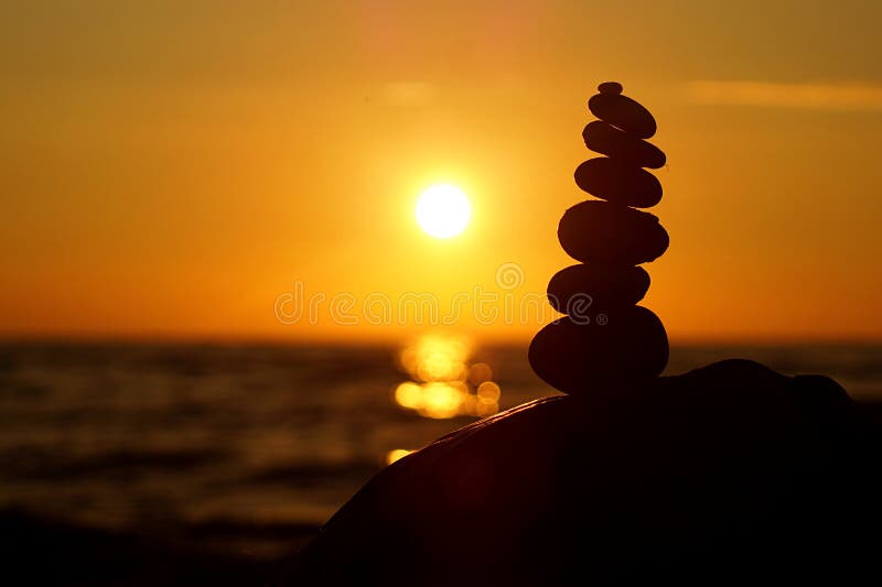 Stack of Different Stones in Balance at the Beach Sunset Stock Image ...