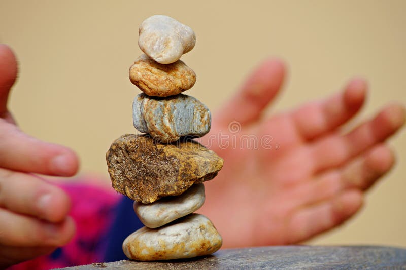 Stack of Different Stones in Balance with Child`s Hands Stock Photo ...