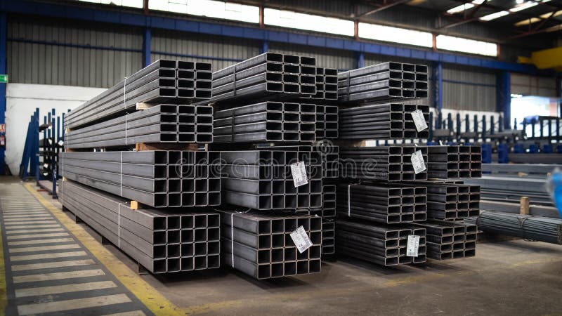 Closeup of Stacke Profile Pipes in a Factory Stock Photo - Image of ...