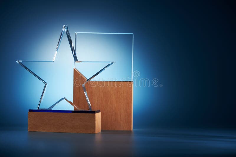 Closeup of a Star-shaped Award Trophy on the Table Against a Blue ...