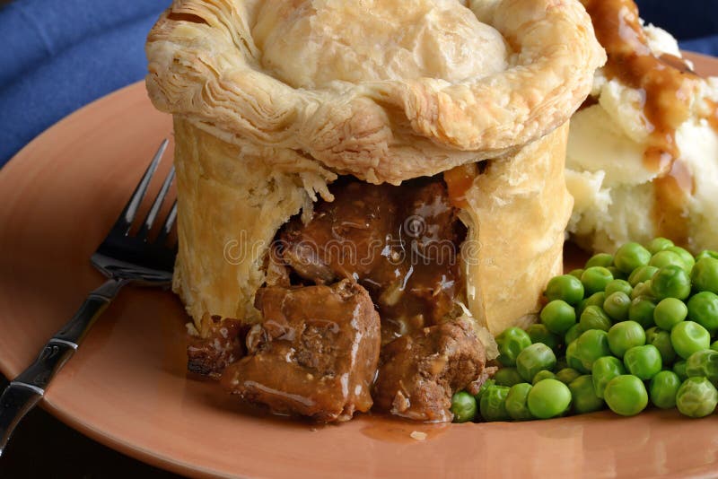 Closeup Steak Pub Pie with Gravy and Fork Stock Photo - Image of meal ...