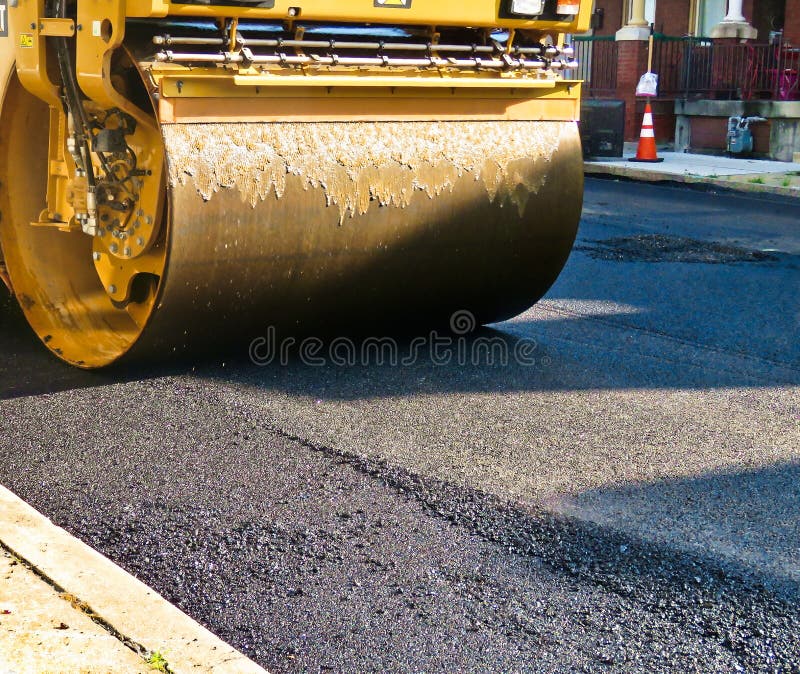 Steamroller Compacts Asphalt in Road Repaving Project. Stock Image ...