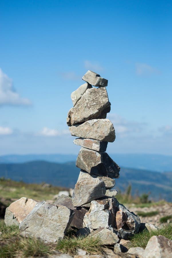 Stone Balance at the Top of the Mountain on Blue Sky Background Stock ...