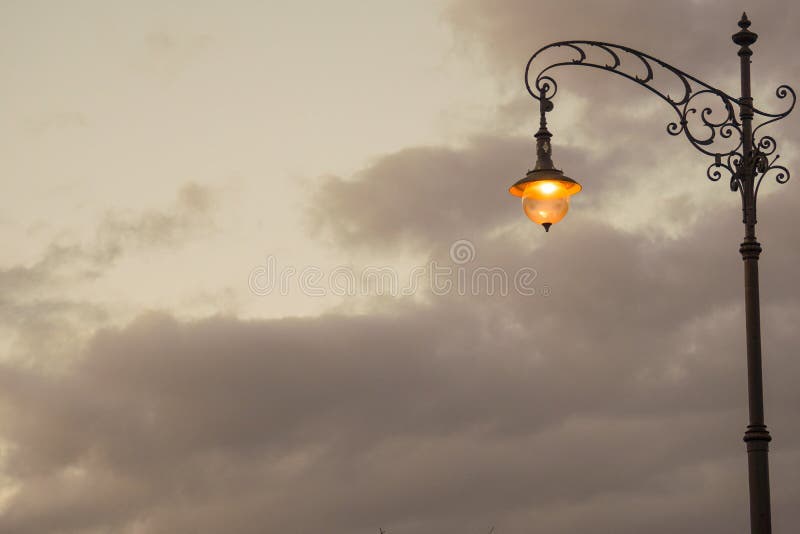 Closeup of a Street Lamp Against the Dramatic Sunset Sky Stock Image ...