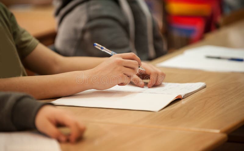 Closeup of Student Hands on School Table Writing To Notebook Stock ...