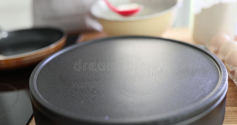 Closeup of Surface of Black Electric Frying Pan and Pancake Batter ...