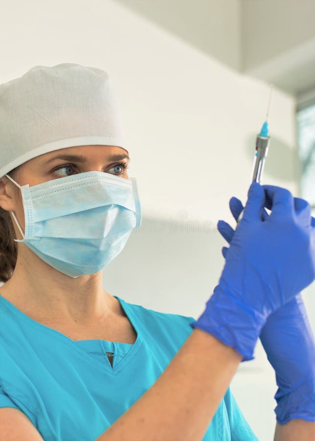 Closeup of Female Doctor Wearing Surgical Cap and Mask at Clinic Stock ...