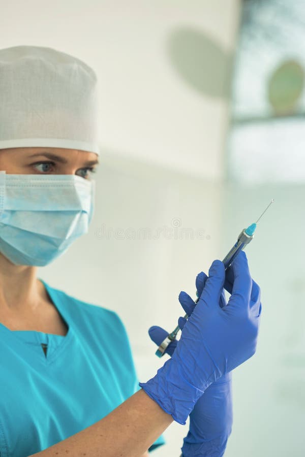 Closeup of Female Doctor Wearing Surgical Cap and Mask at Clinic Stock ...