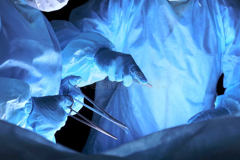 Closeup of Surgeons Performing Operation. Focus on Human Hands Using ...