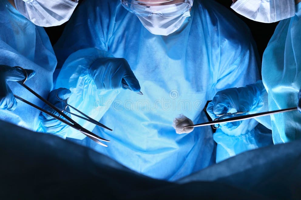 Closeup of Surgeons Performing Operation. Focus on Human Hands Using ...