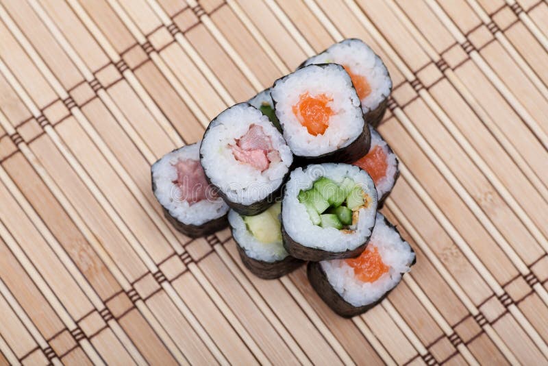 Closeup Sushi Roll on Bamboo Mat Stock Photo - Image of delicious ...