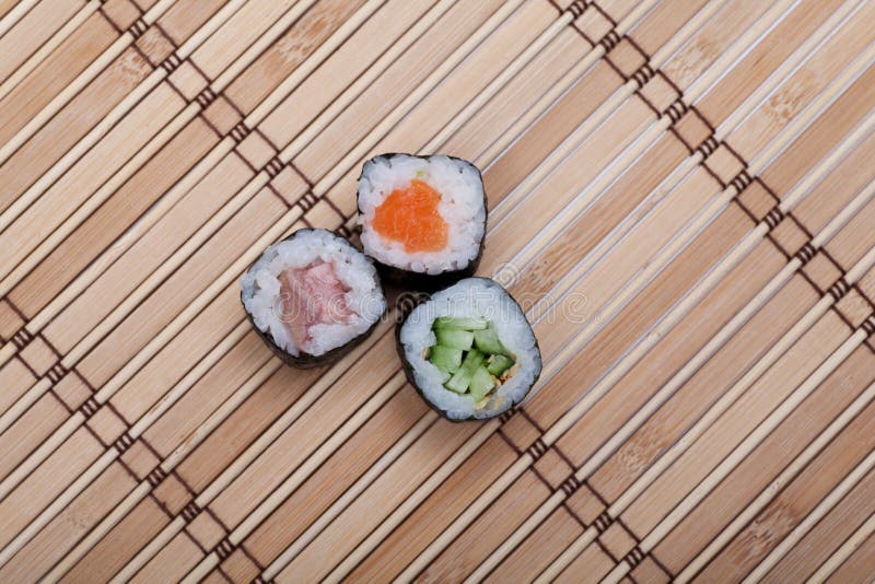 Closeup Sushi Roll on Bamboo Mat Stock Image - Image of gourmet, rice ...